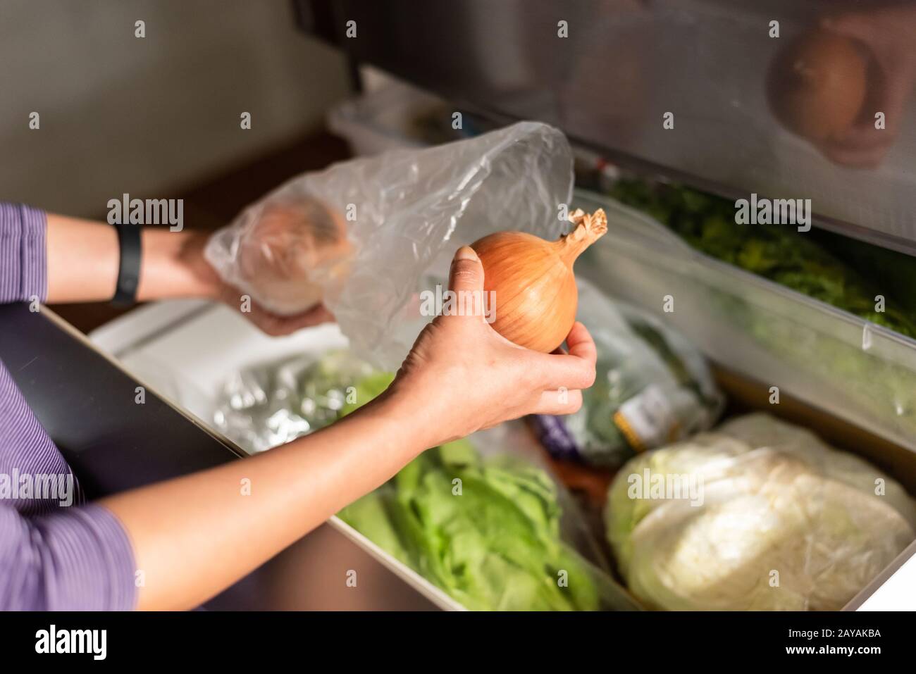 take vegetables from refrigerator Stock Photo - Alamy