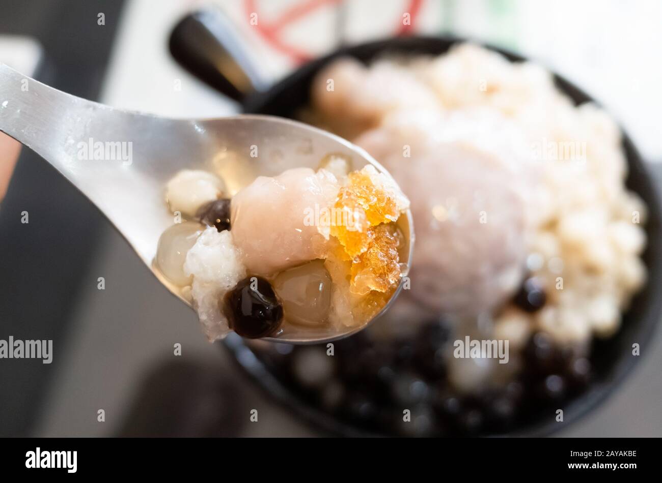eating shaved ice with colorful dessert Stock Photo - Alamy