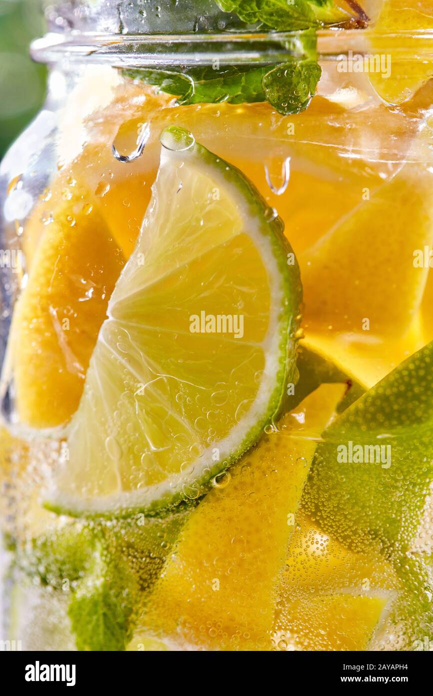 Cold refreshing water with lime and lemon in a glass Stock Photo - Alamy