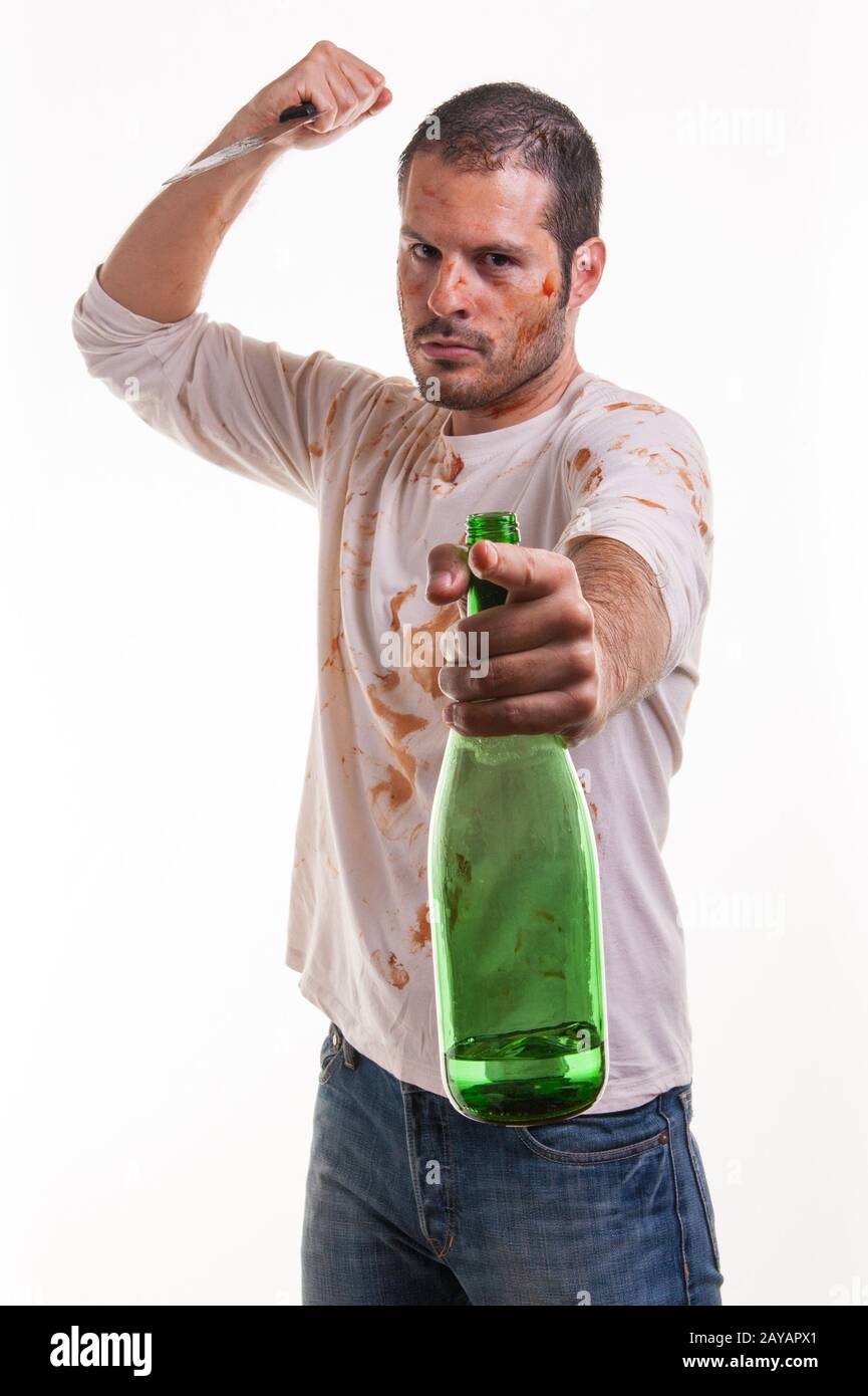 A bloody scene with a man and a blood-covered knife in his hand ...