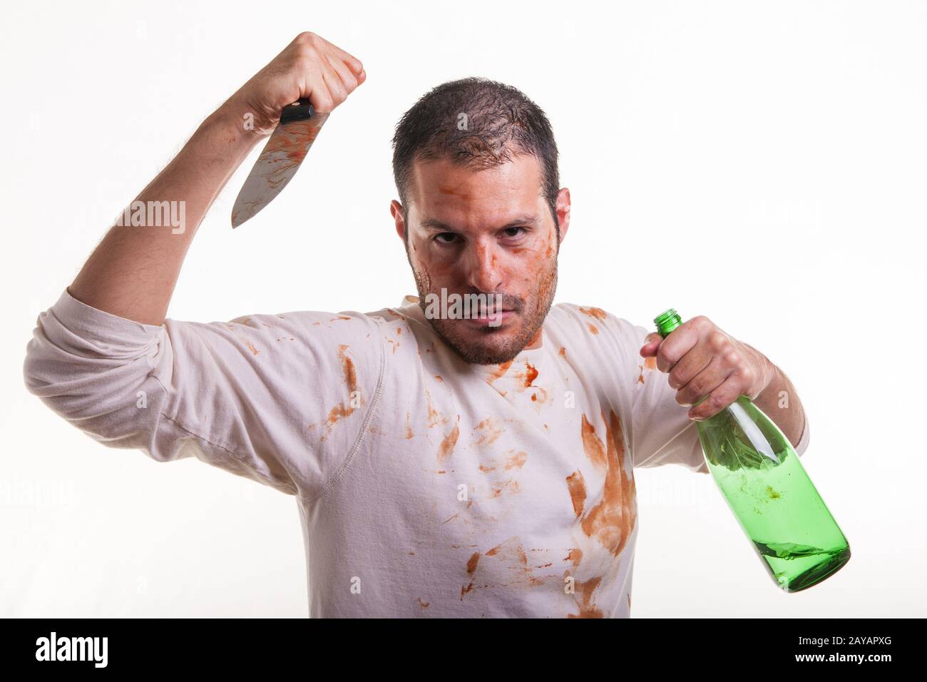 A bloody scene with a man and a blood-covered knife in his hand ...