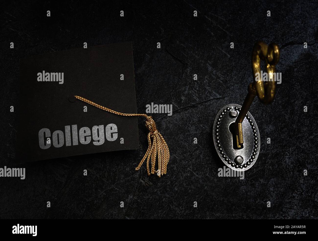 Key and college education graduation cap Stock Photo - Alamy