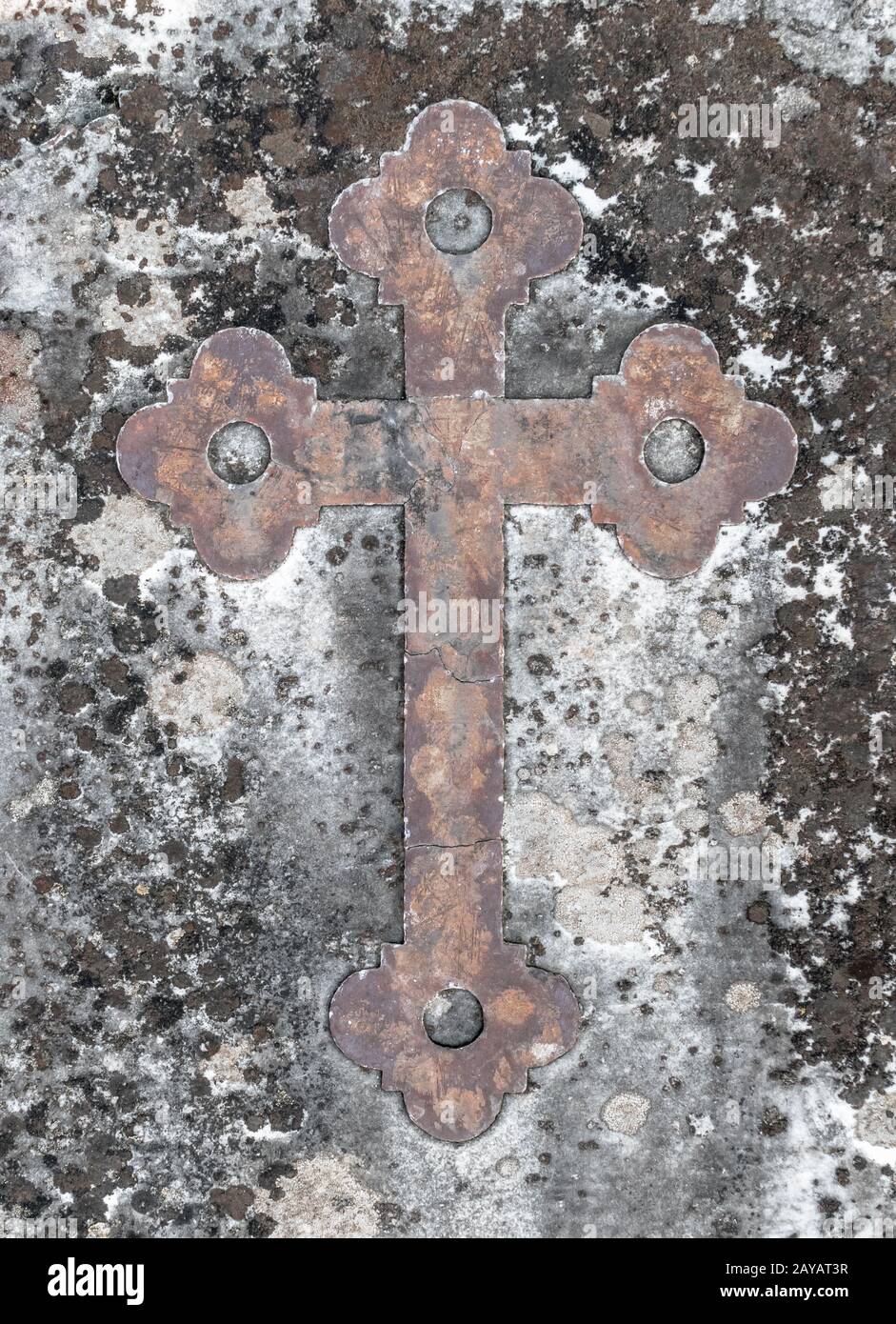 Ancient rusty cross on a old stone Stock Photo - Alamy