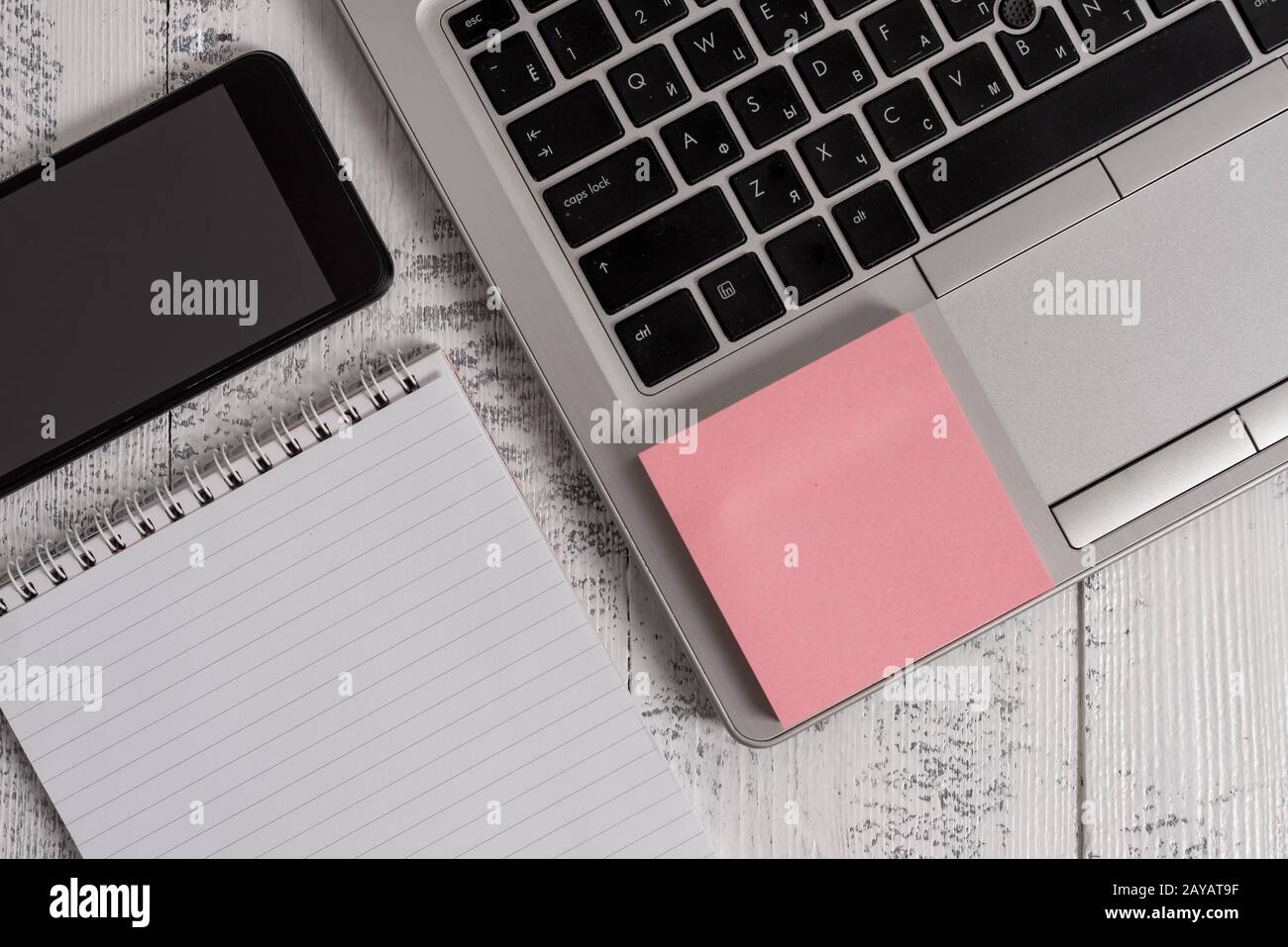 Trendy metallic laptop ruled spiral notepad sticky note smartphone ...