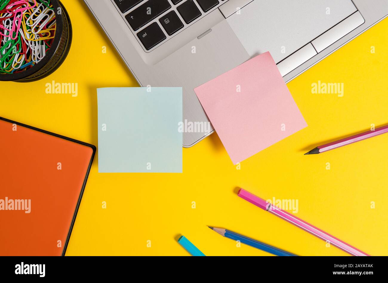 Front view open trendy metallic silver slim laptop blank sticky notes ...