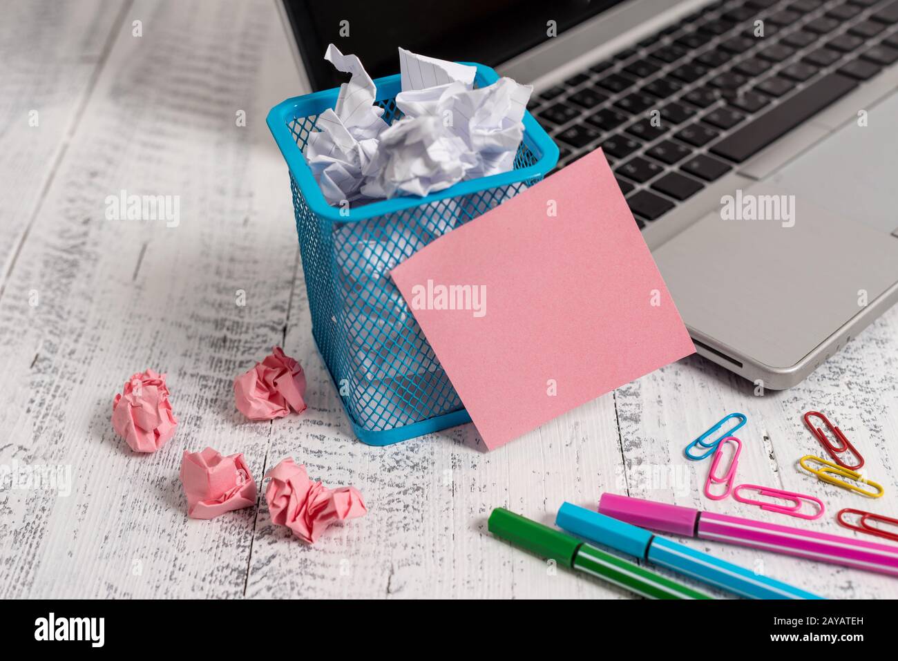 Trendy metallic laptop sticky note pad waste basket crushed paper balls ...