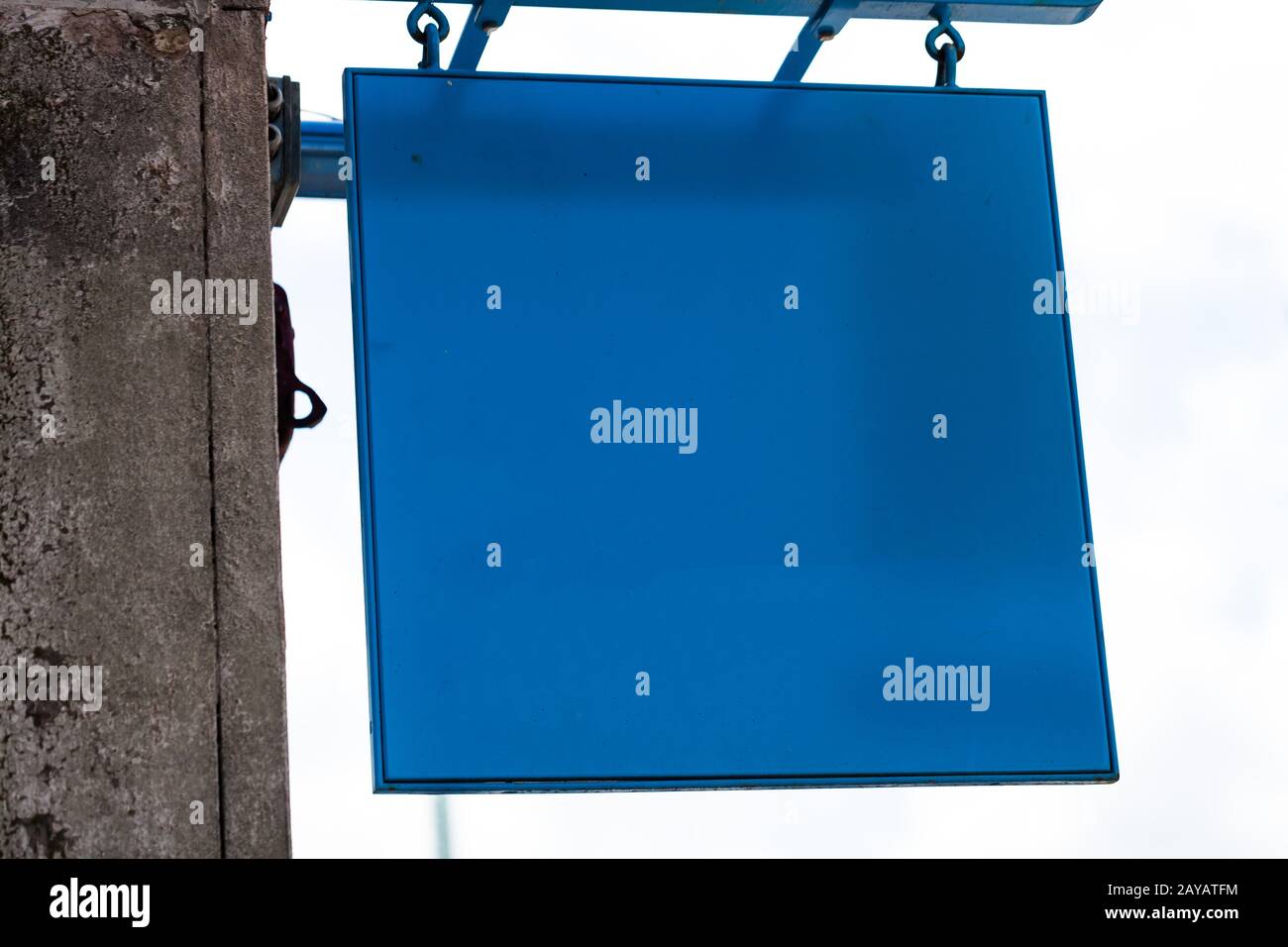 Modern metal rectangle sign hanging on street post with blank space to ...