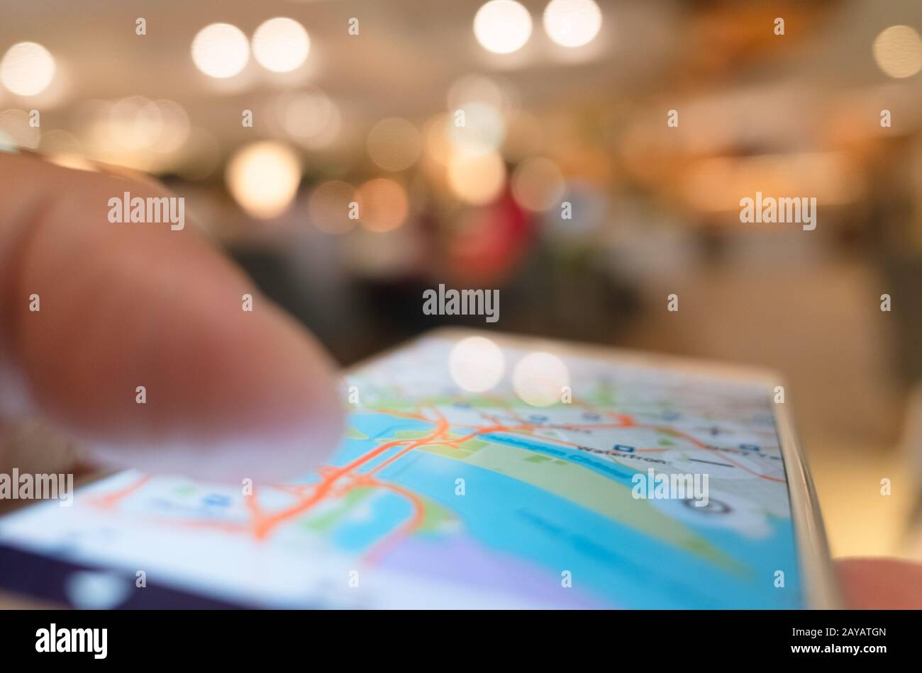 check the map on smartphone Stock Photo - Alamy