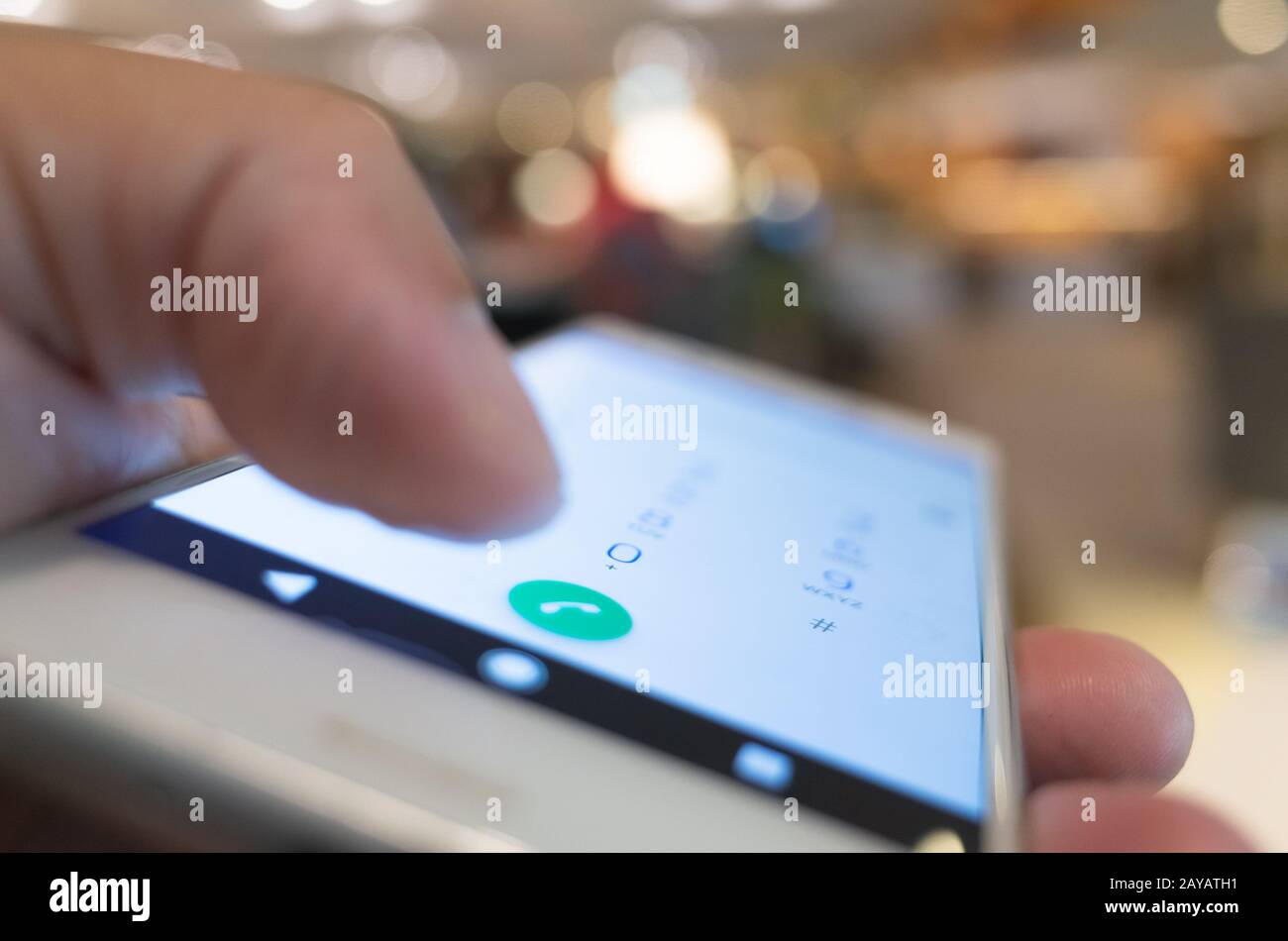 using cellphone to dial Stock Photo - Alamy