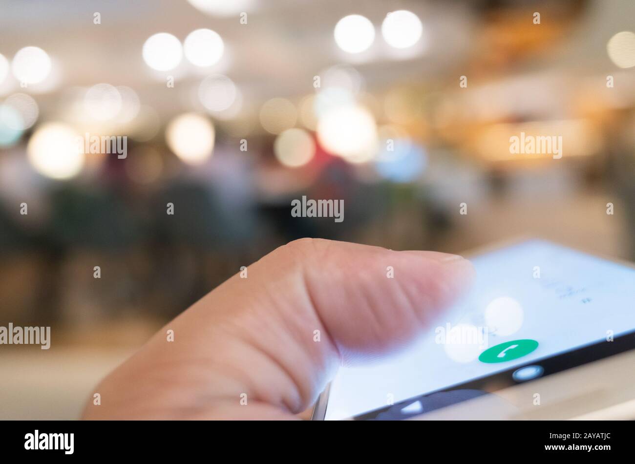 using cellphone to dial Stock Photo - Alamy