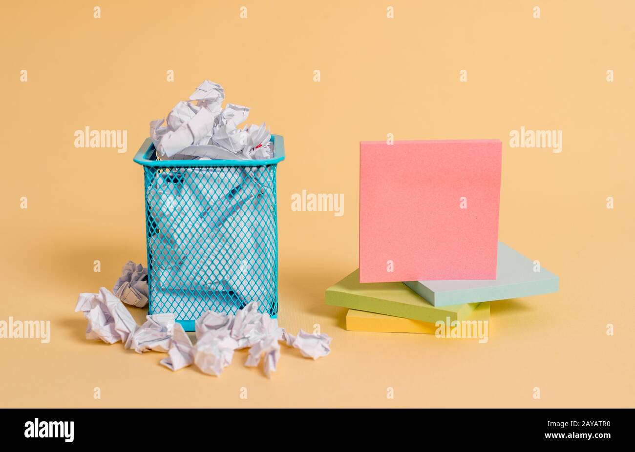 Crumpled paper and stationary in trash can. Note sheet with writing ...