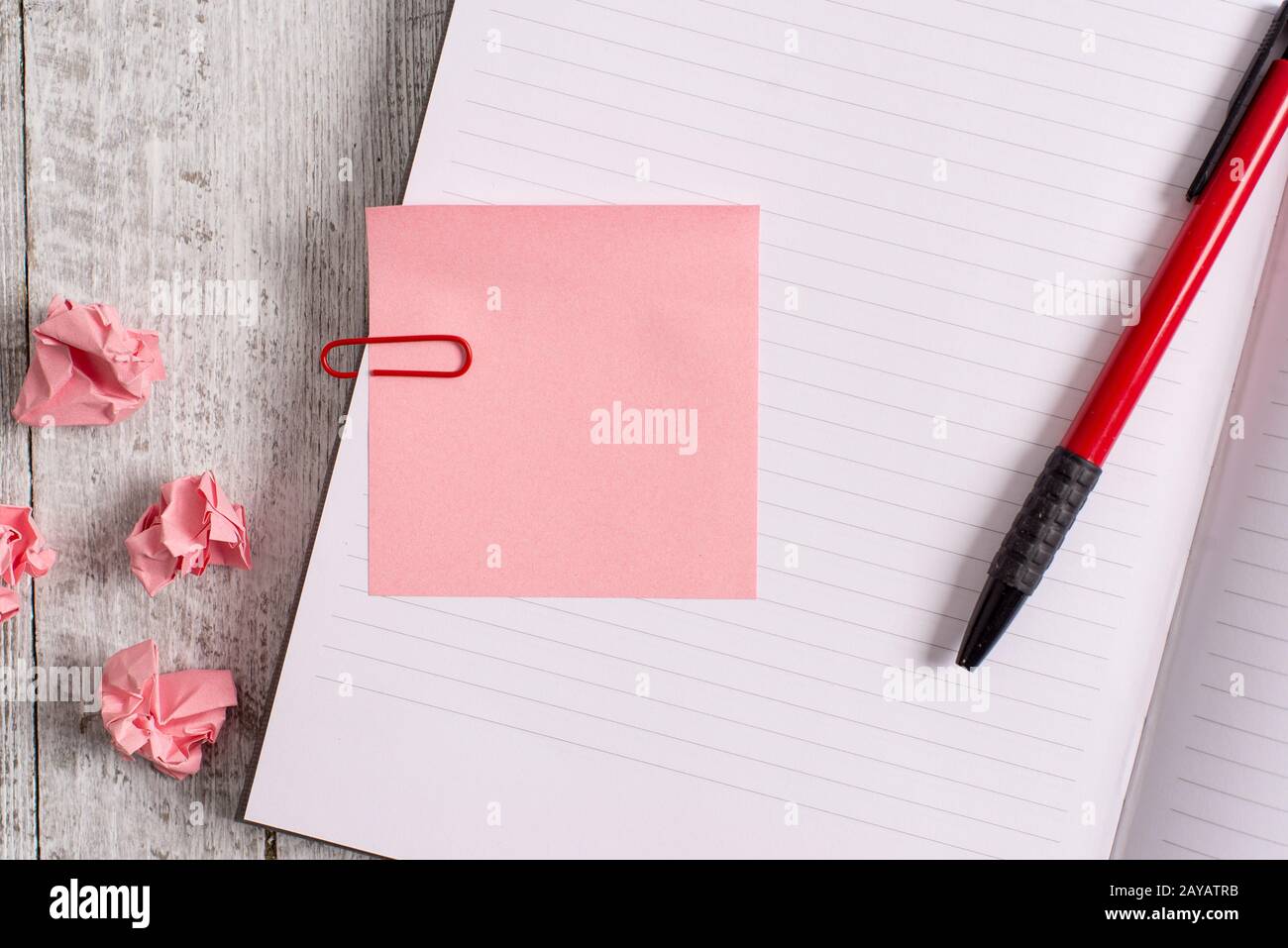 Thick pages notebook stationary on the top of a wooden table. Writing ...