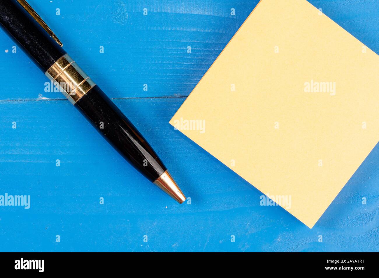 Close up view colored wooden crashed holes background sticky note pads ...
