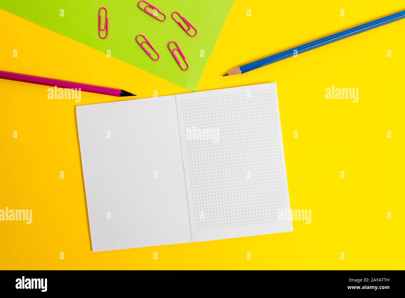 Blank squared notebook colored paper sheet clips pencils highlighters ...