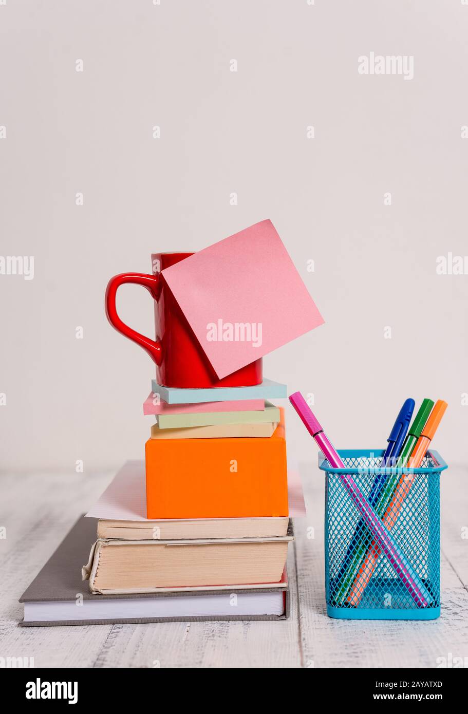Cup blank colored sticky note stacked note pads books square box pens ...