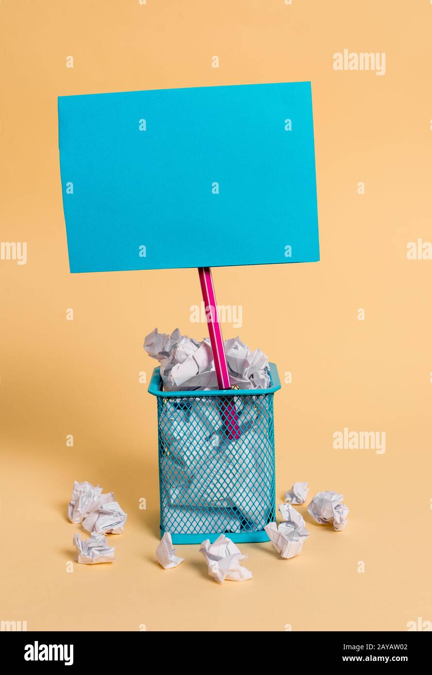 Crumpled paper and stationary in trash can. Note sheet with writing ...