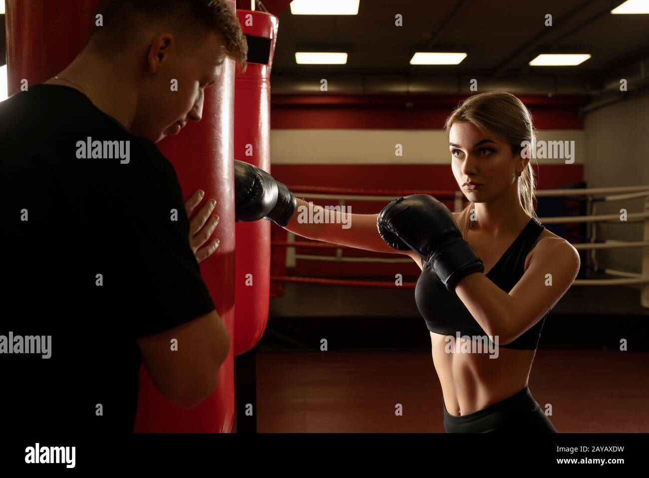 Boxer working out with trainer in gym Stock Photo - Alamy