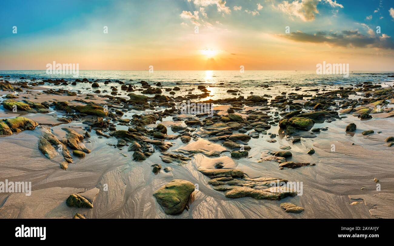 Sunset landscape with sand beach Stock Photo - Alamy