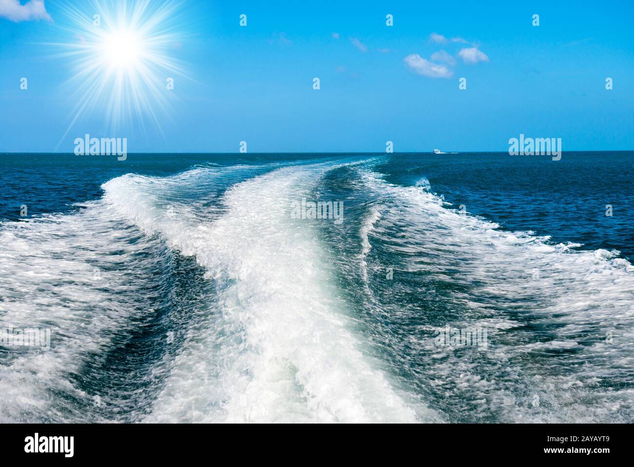 Wave of boat on water surface Stock Photo - Alamy