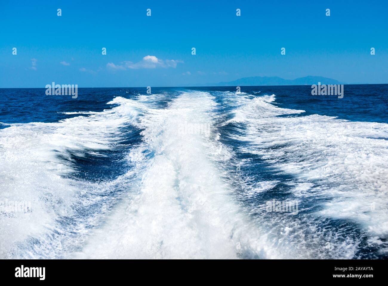 Wave from boat on water surface Stock Photo - Alamy