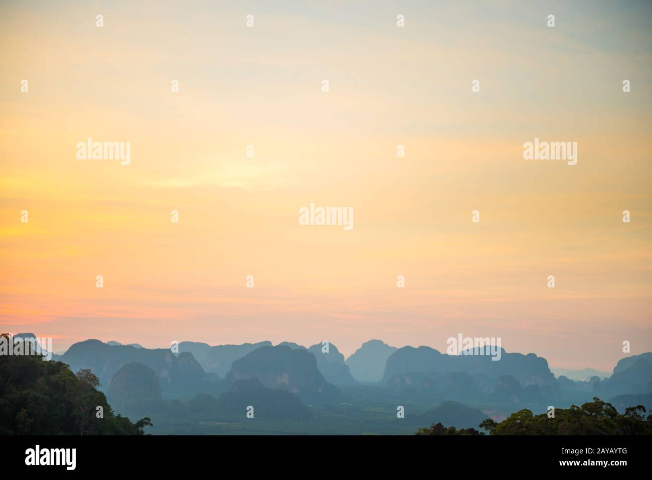 Landscape with sunset and blue mountains Stock Photo - Alamy