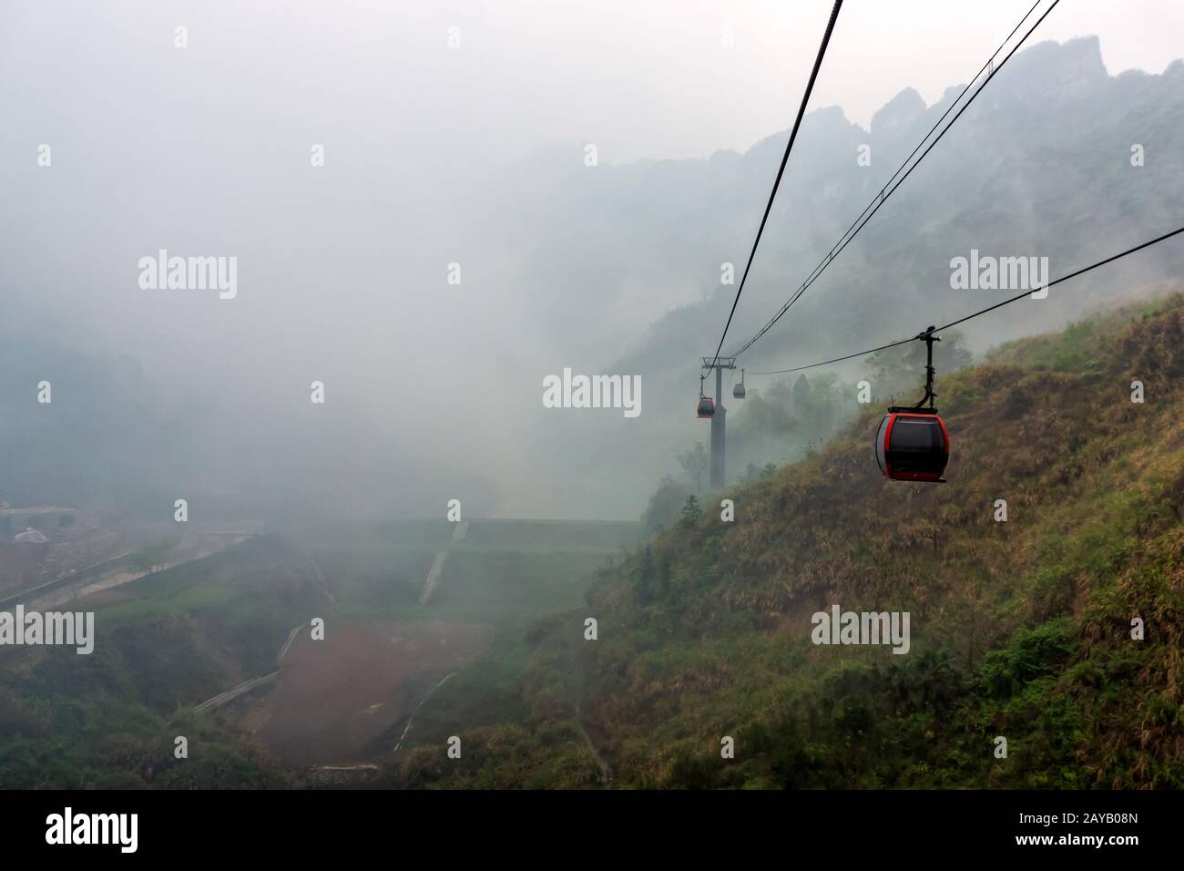 Cable way vanishing in mist or fog in Tianmen Mountain Stock Photo - Alamy