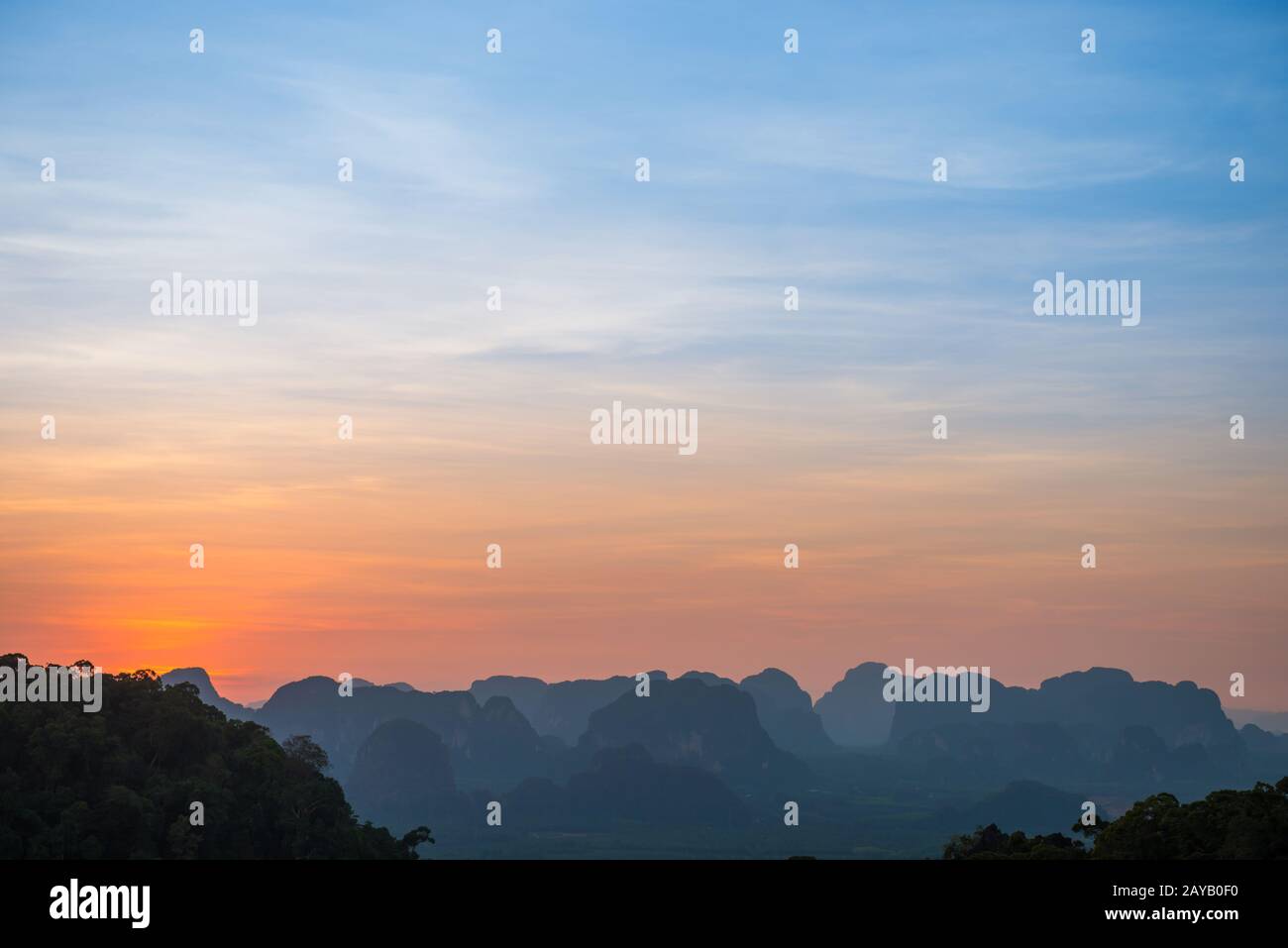 Landscape with sunset and blue mountains Stock Photo - Alamy
