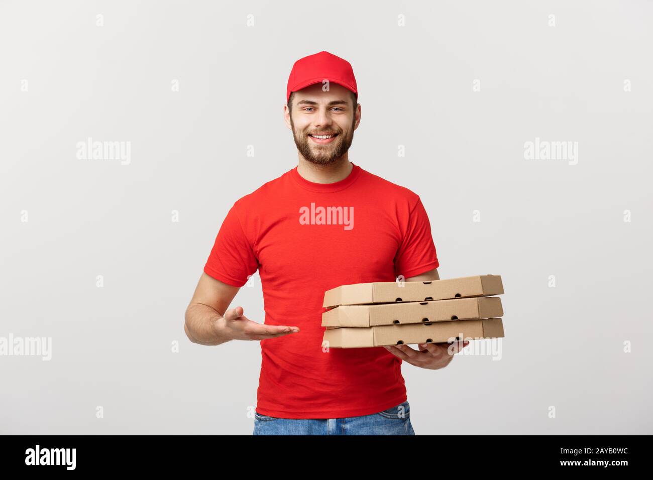Delivery Concept: Portrait of Pizza delivery man presenting something ...