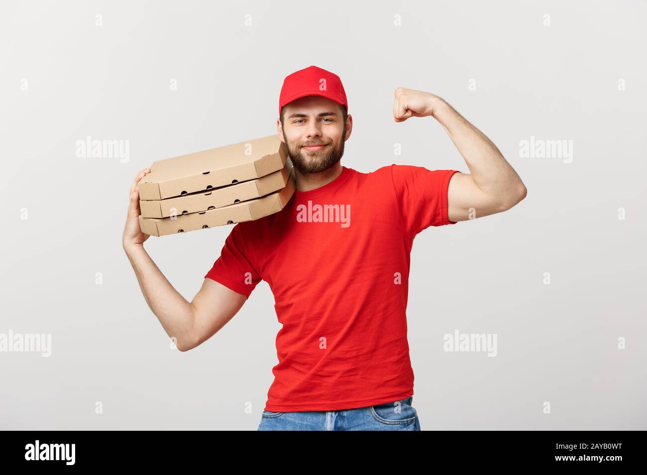 Delivery Concept - Portrait of Strong handsome delivery man flexing his ...