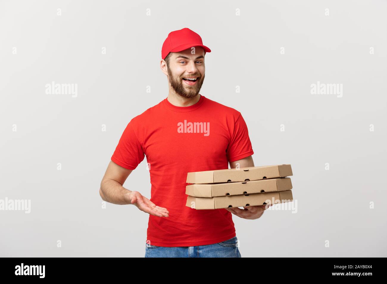 Delivery Concept: Portrait of Pizza delivery man presenting something ...
