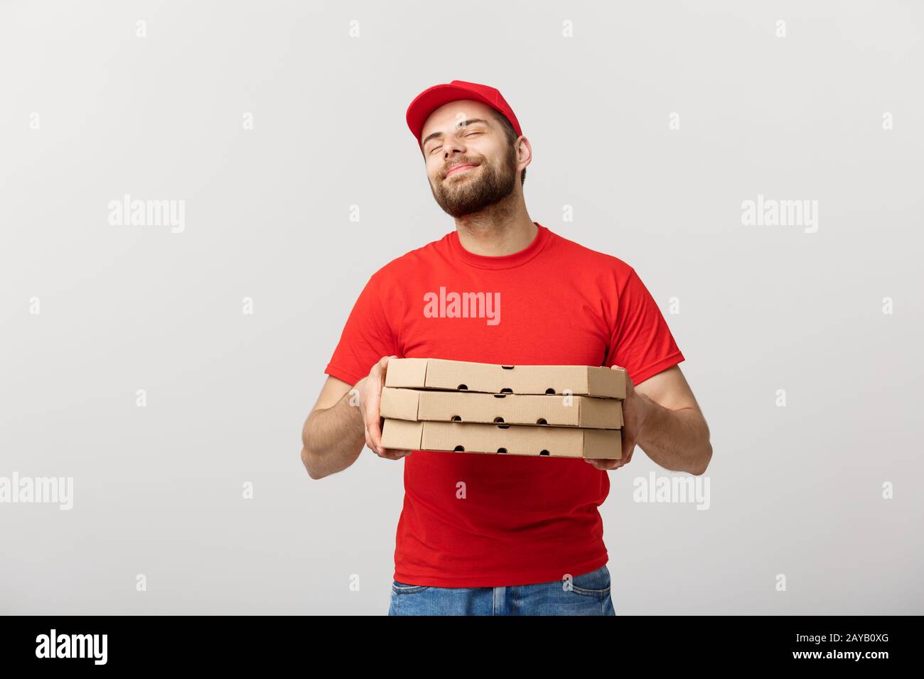 Delivery Concept: Handsome Pizza delivery man showing delicious ...