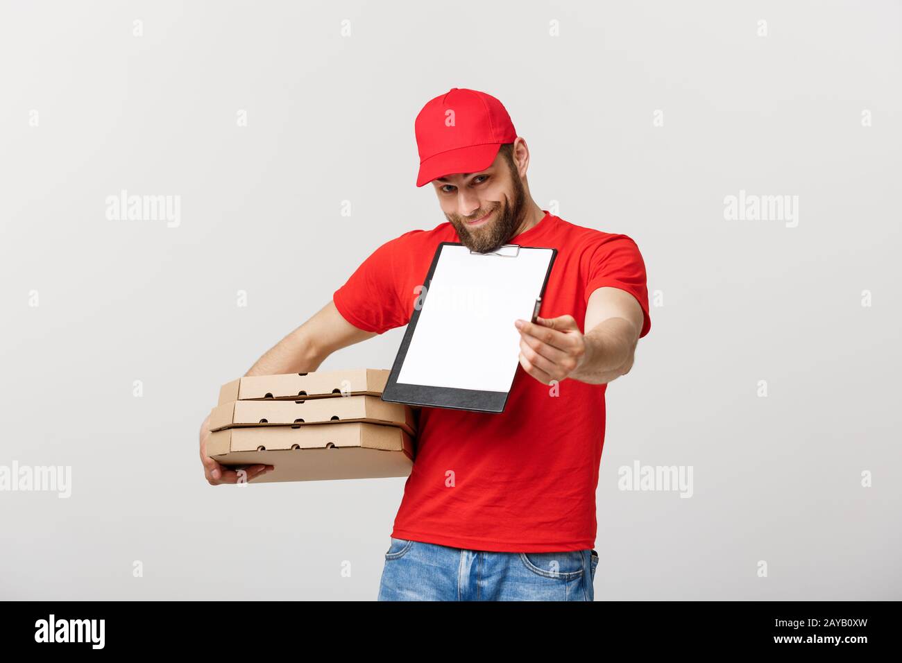 Delivery Concept: Young handsome delivery man with pizza boxes giving ...