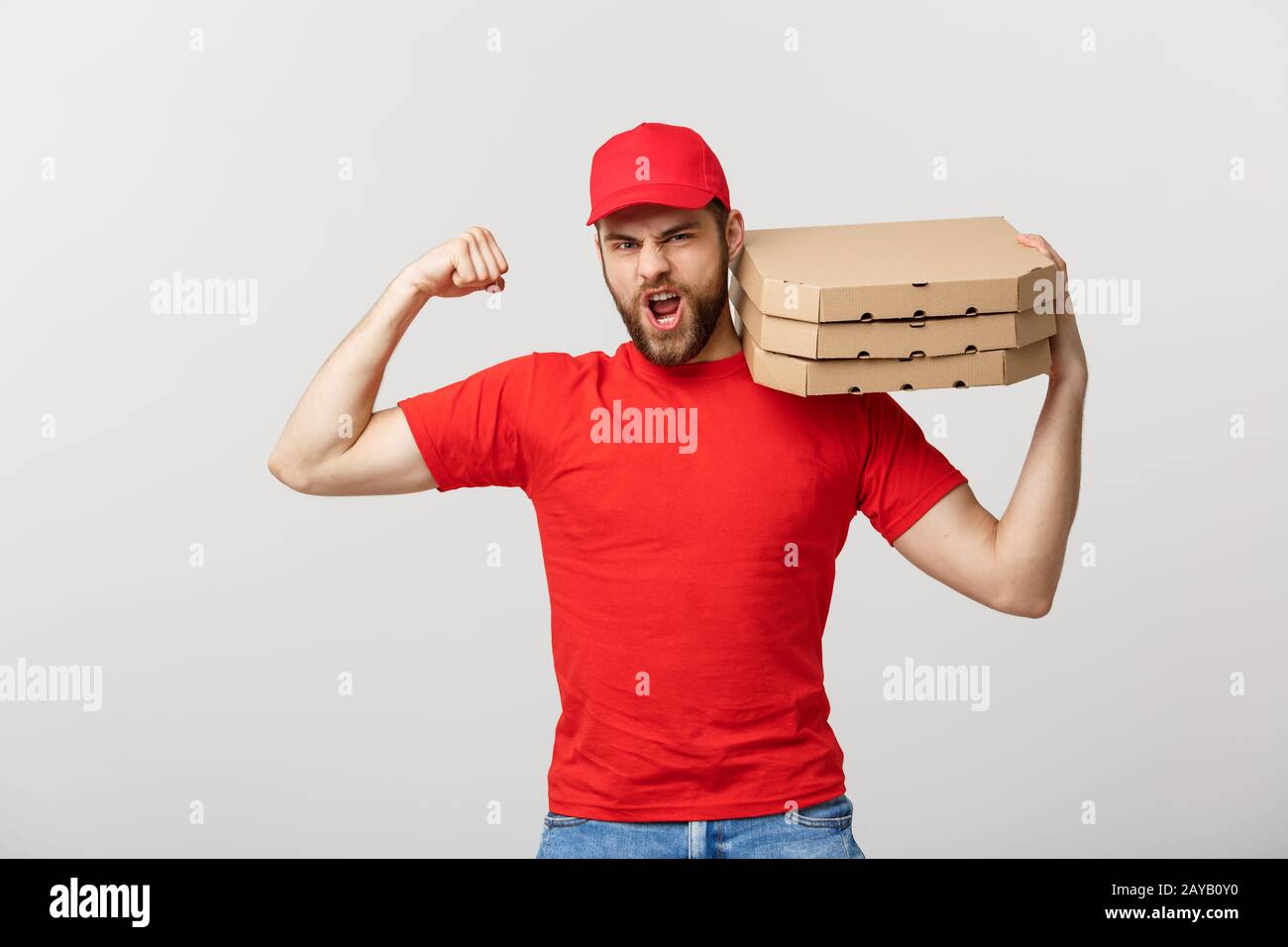 Delivery Concept - Portrait of Strong handsome delivery man flexing his ...