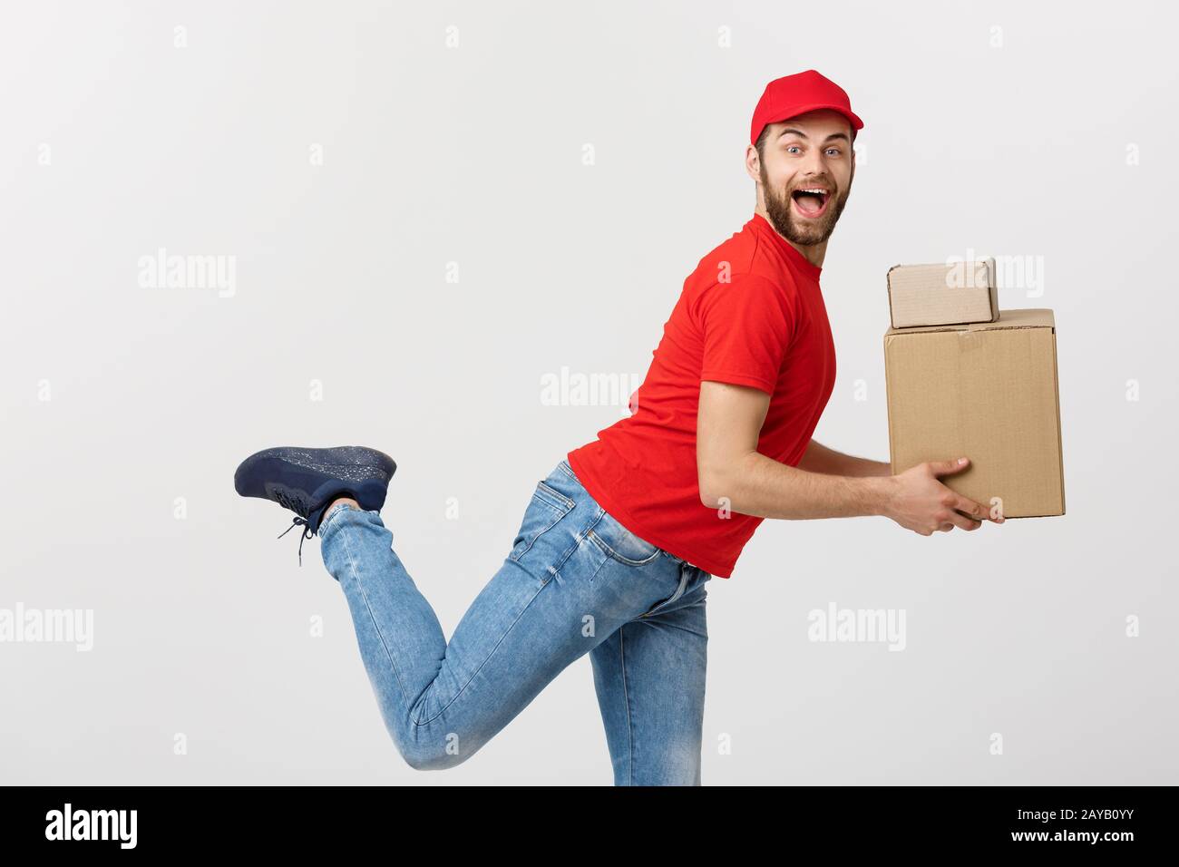 Delivery Concept - Handsome caucasian delivery man rush running for ...