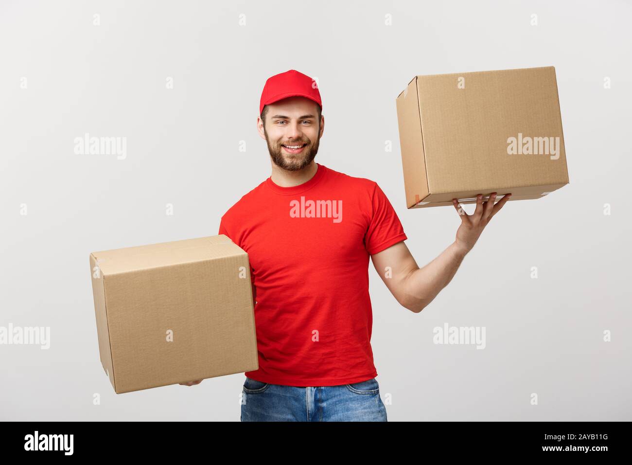 Portrait delivery man in cap with red t-shirt working as courier or ...