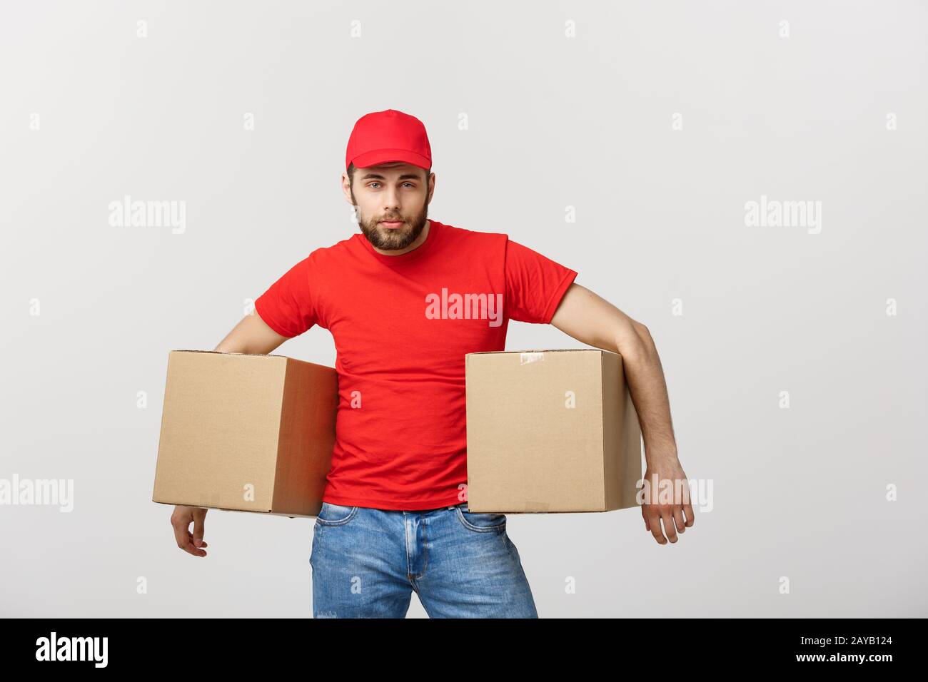 Portrait delivery man in cap with red t-shirt working as courier or ...
