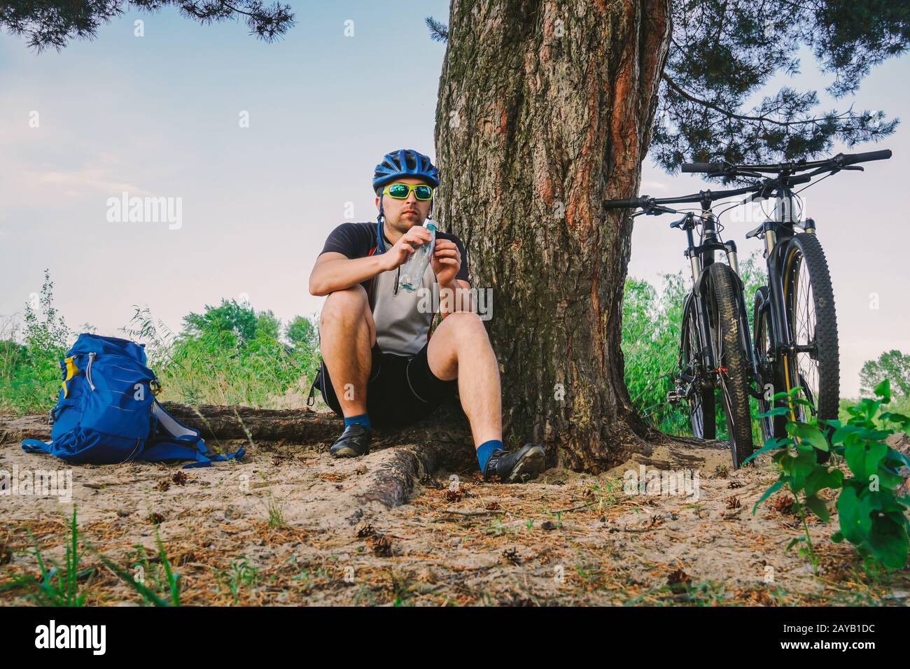Man resting under tree hi-res stock photography and images - Alamy