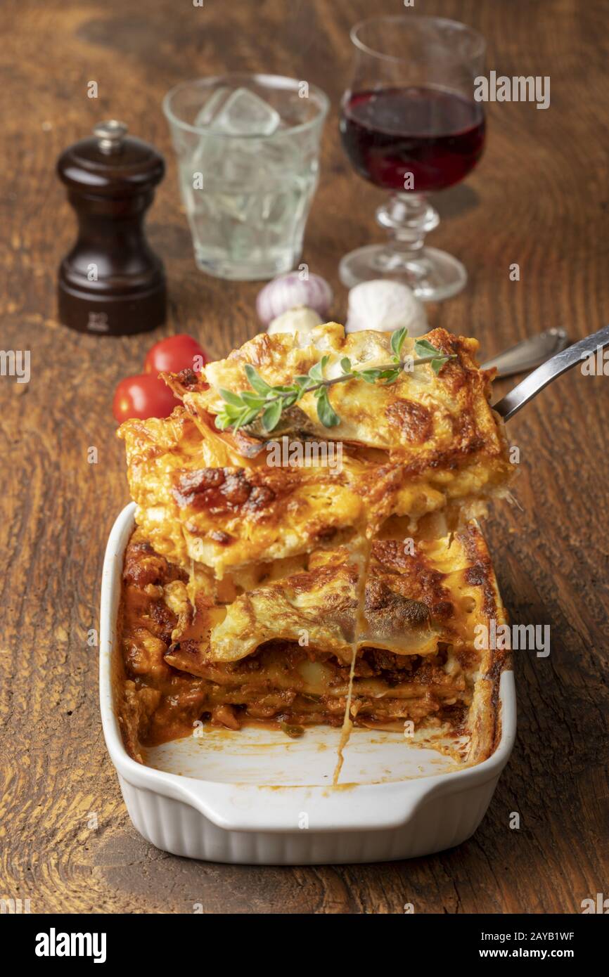 Overview of a cooked lasagne on wood Stock Photo - Alamy