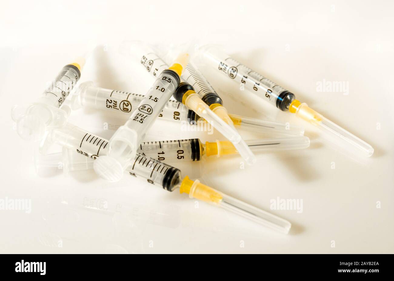 Syringes on white background Stock Photo - Alamy