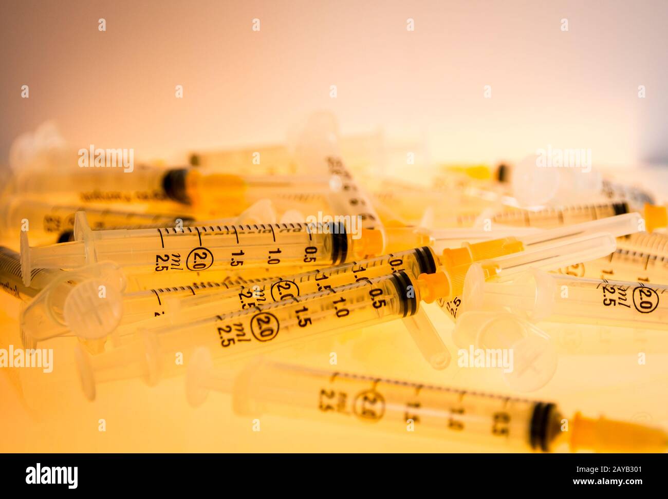 Plastic orange syringe isolated on hi-res stock photography and images ...