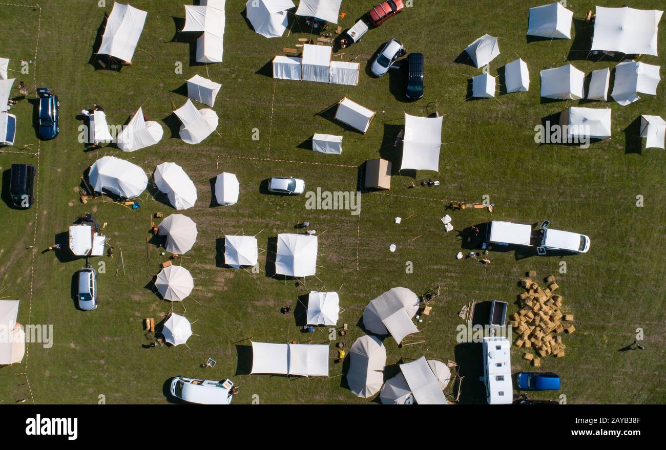 Aerial view of a tent camp and market stalls at a medieval spectacle ...