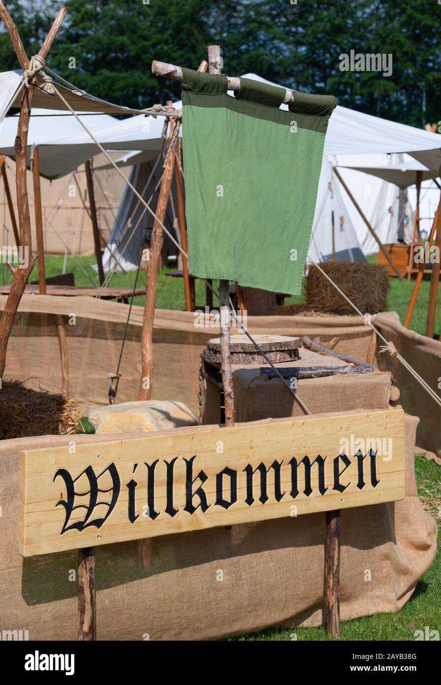 Entrance at a medieval spectacle welcome sign Stock Photo - Alamy