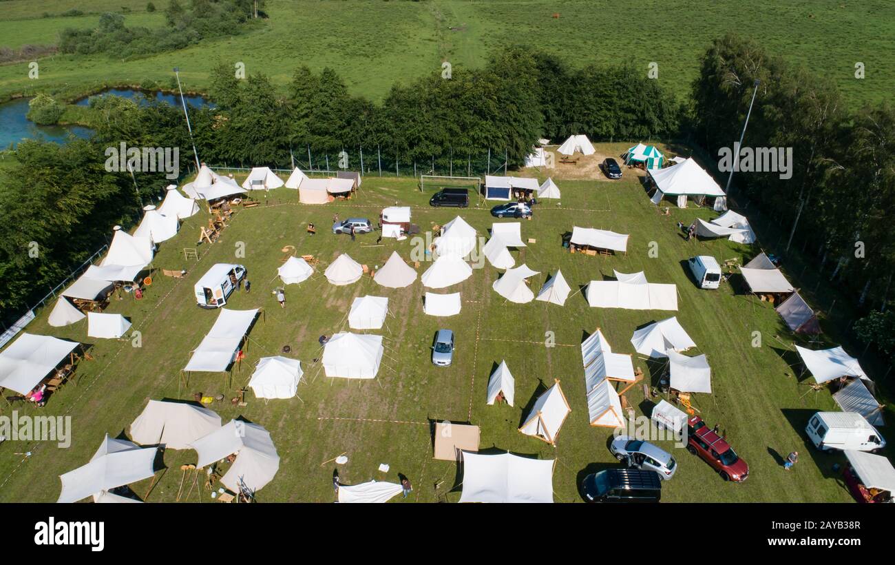 Aerial view of a tent camp and market stalls at a medieval spectacle ...