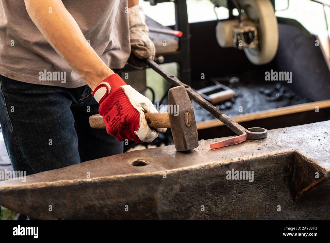 Blacksmith in the Field forge Stock Photo - Alamy