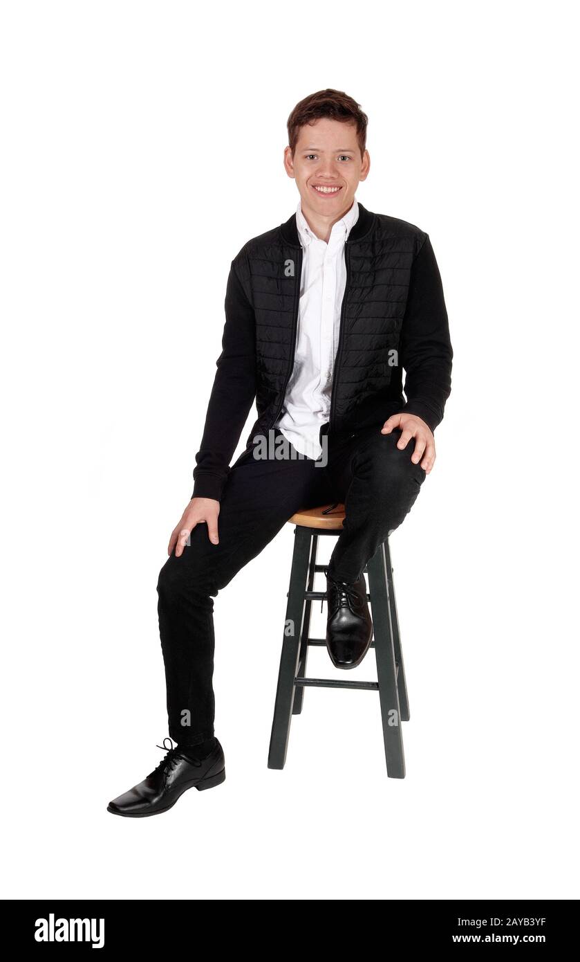 Boy sitting on chair Cut Out Stock Images & Pictures - Alamy