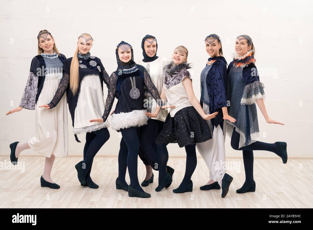Group of beautiful girls in design costumes shot Stock Photo - Alamy