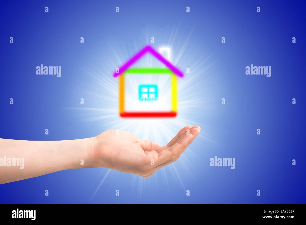 Small house in a hand Stock Photo - Alamy
