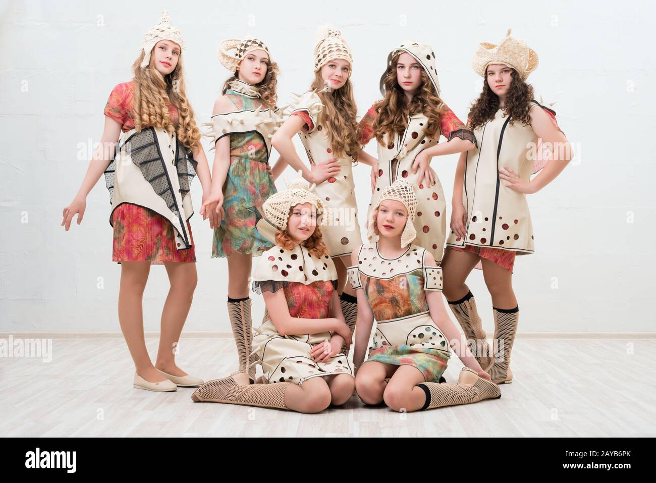 Girls in colorful dresses and hats portrait Stock Photo - Alamy