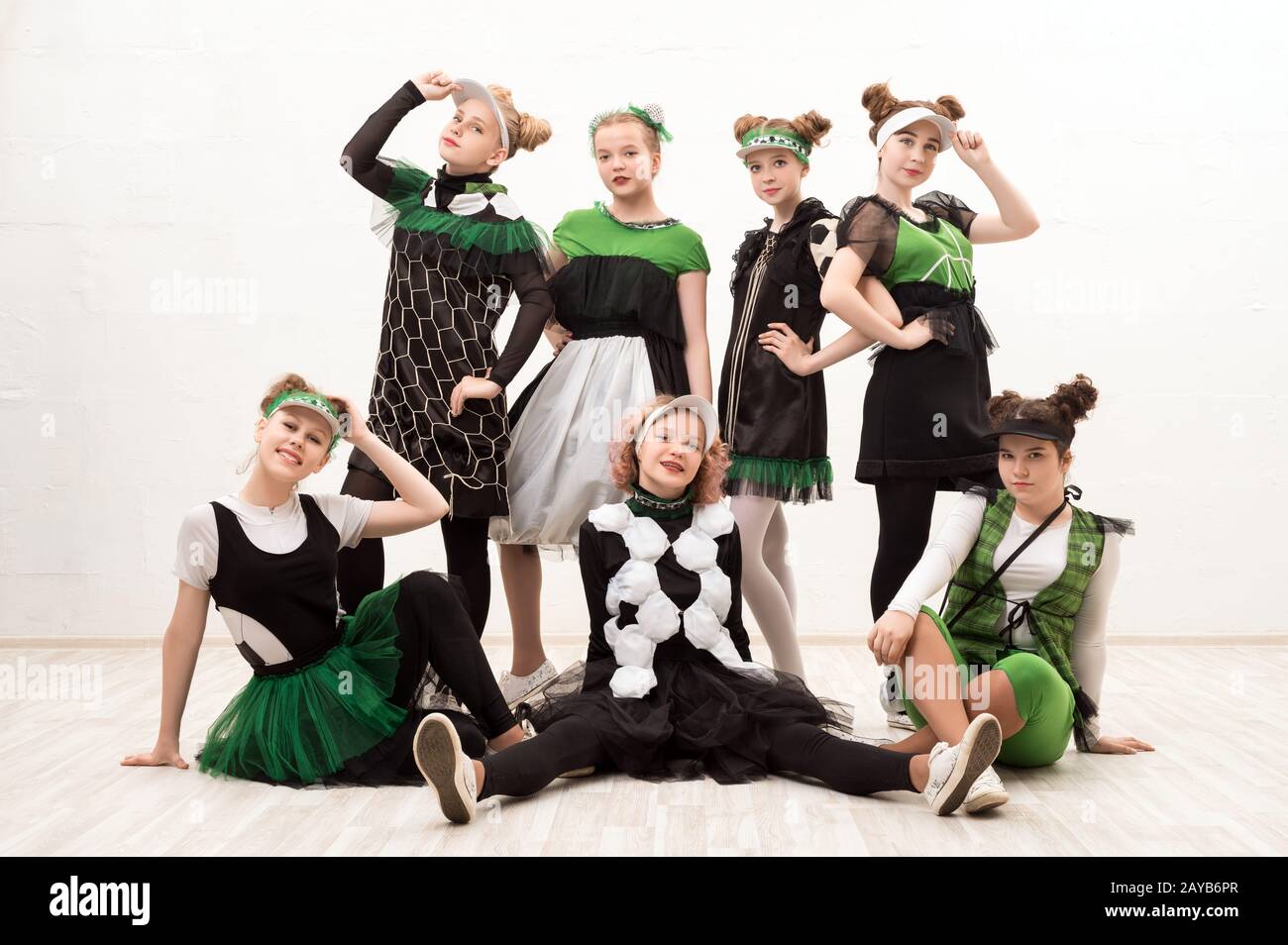 Girls in fashion costumes isolated group portrait Stock Photo - Alamy