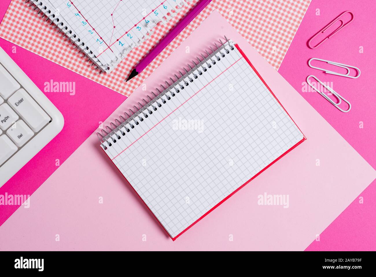 Writing equipments and computer stuffs plus mathematic paper placed on ...